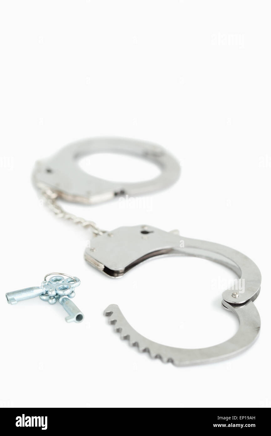 Portrait of handcuffs and keys Stock Photo - Alamy