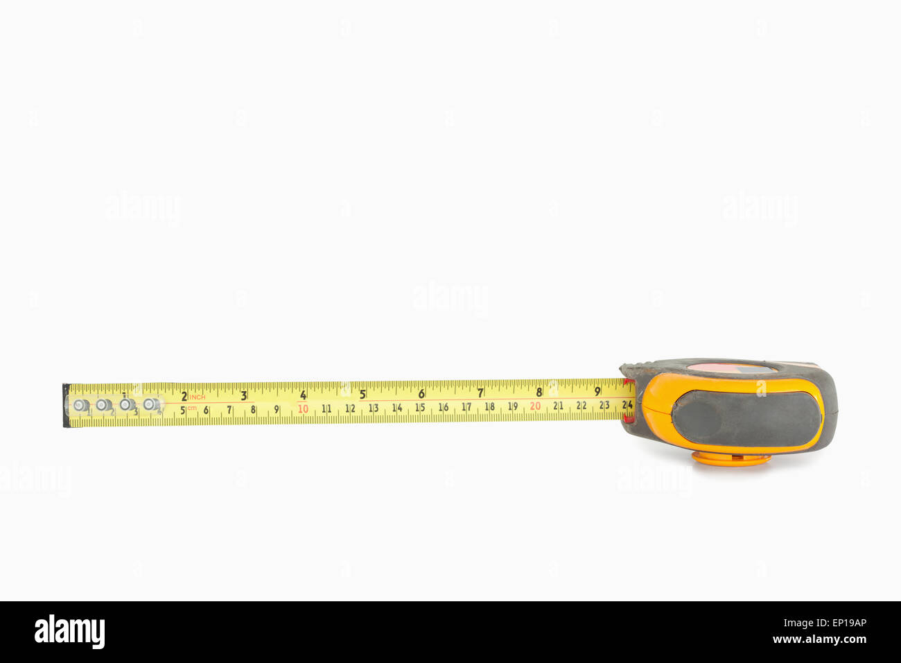 Yellow measuring tape partly unrolled Stock Photo - Alamy