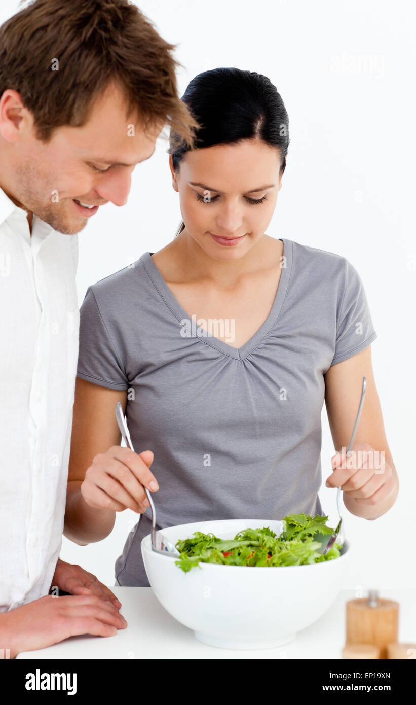 Cute couple preparing a salad together Stock Photo - Alamy
