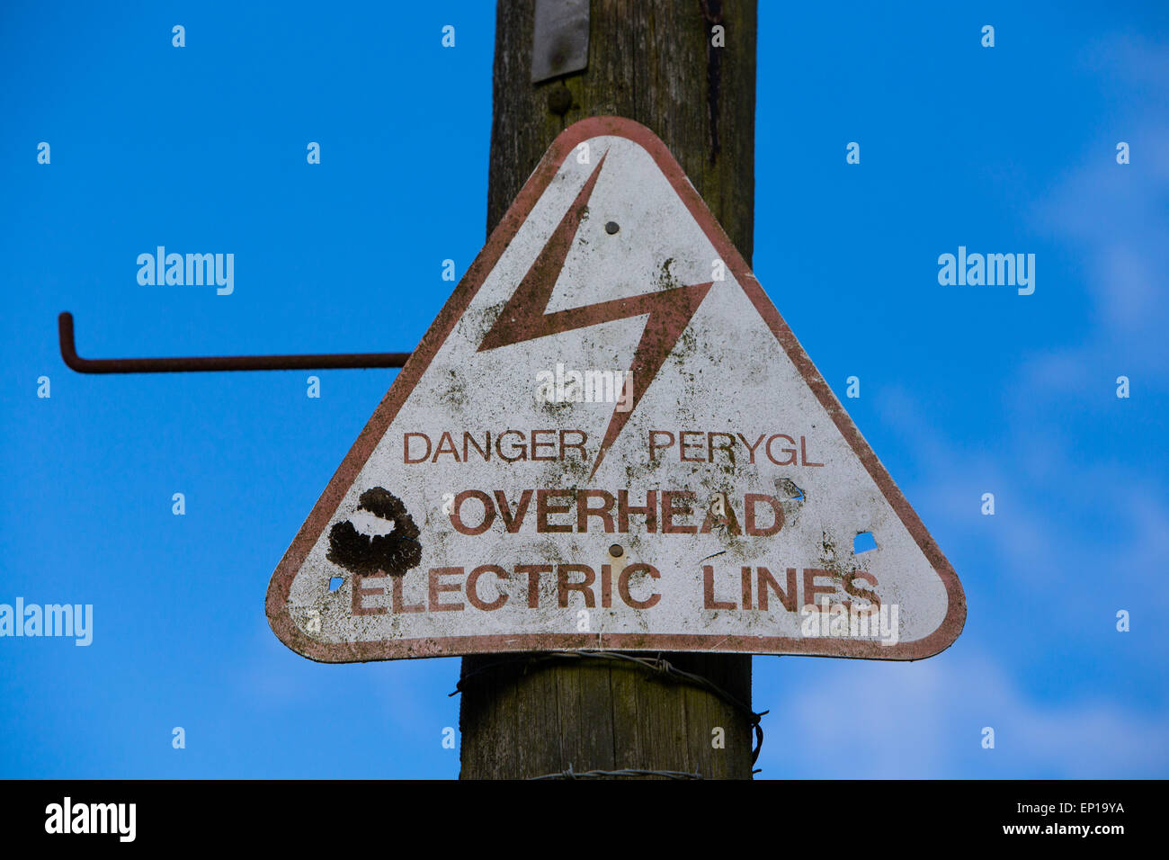 Danger Overhead Electric Lines sign Stock Photo - Alamy