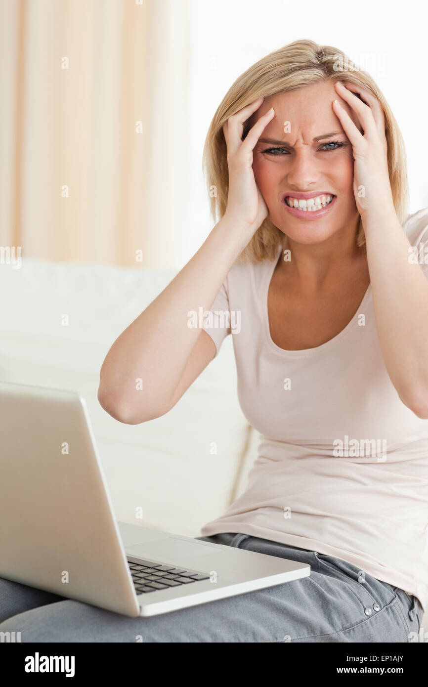 Angry woman with a laptop Stock Photo - Alamy