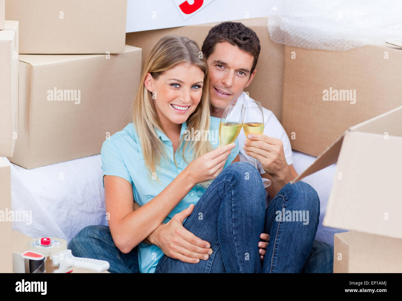 Cheerful couple toasting with Champagne Stock Photo - Alamy
