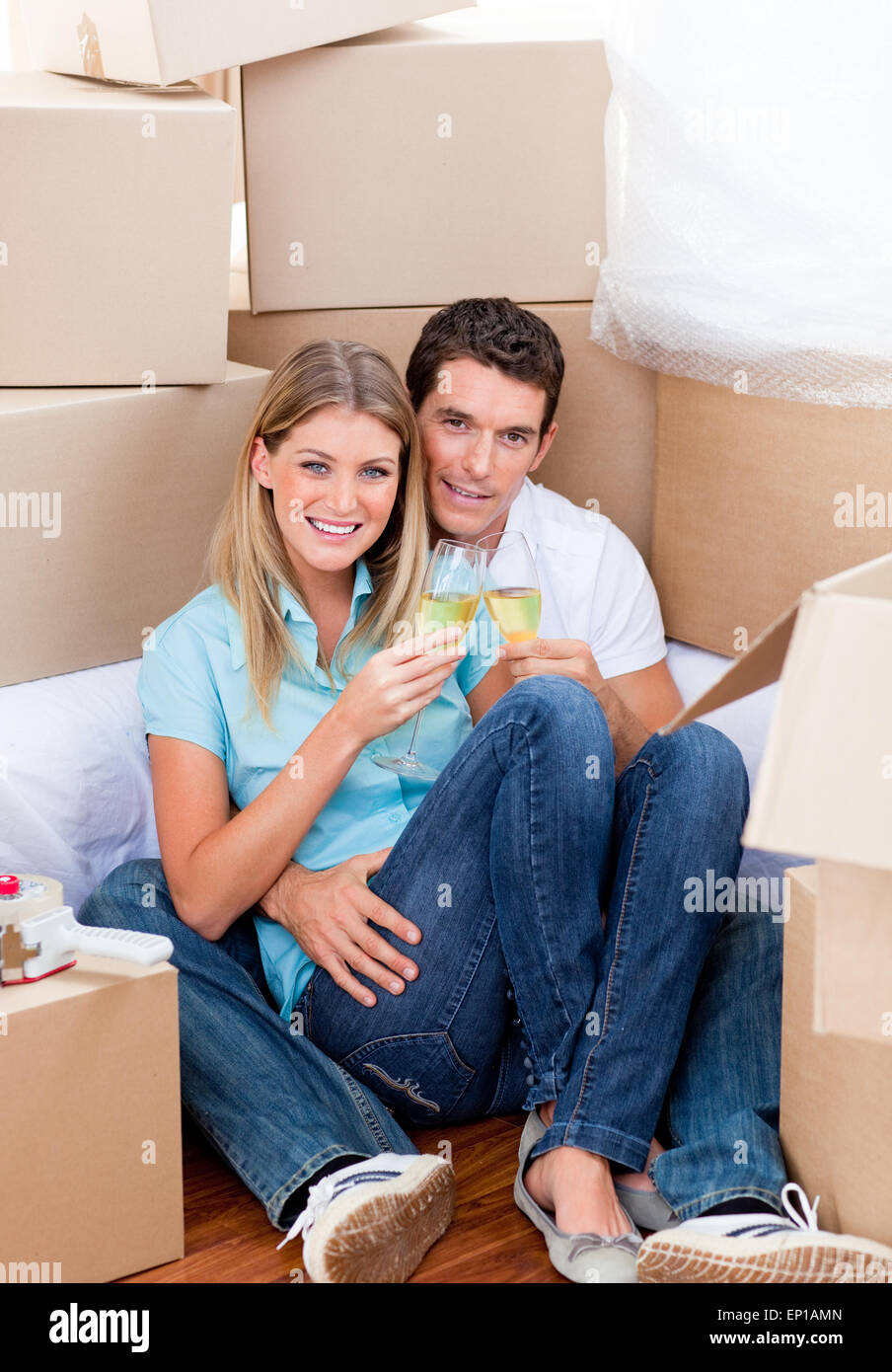 Smiling couple toasting with Champagne Stock Photo - Alamy