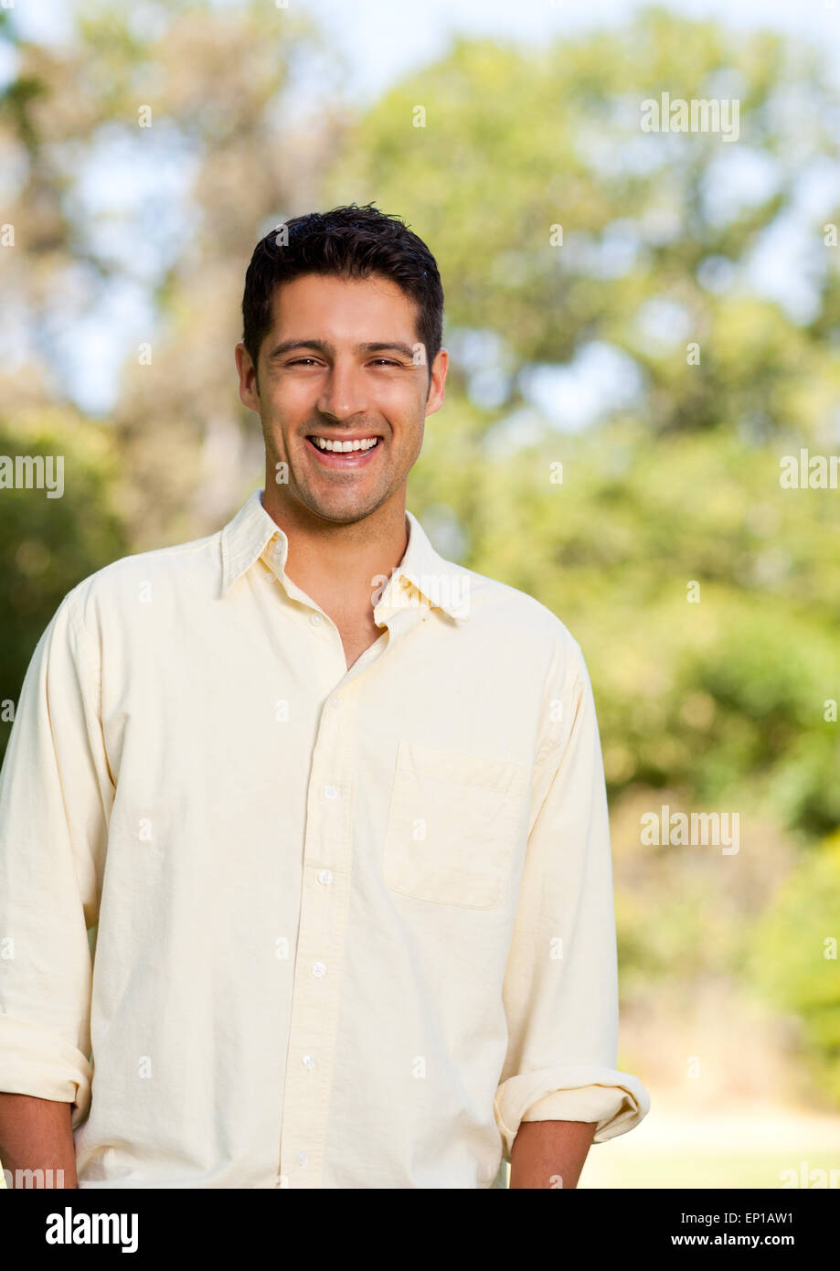 Handsome man in the park Stock Photo - Alamy