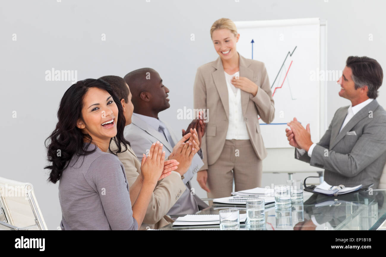 Businesswoman standing smilling after a presentation Stock Photo - Alamy