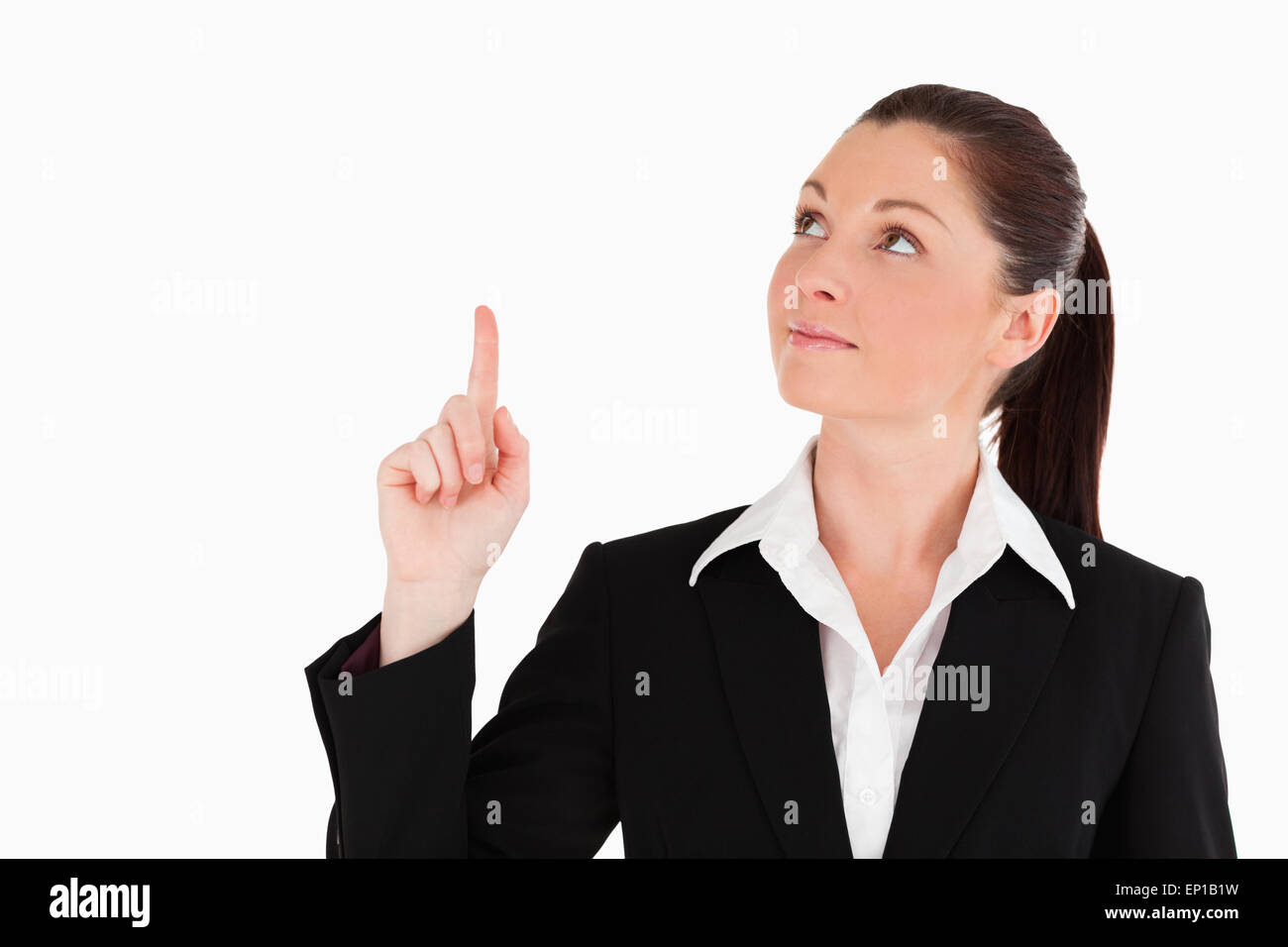 Pretty woman in suit pointing at a copy space Stock Photo - Alamy