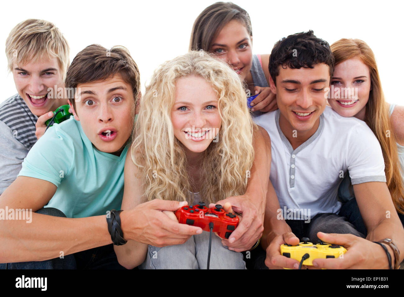 Excited teenagers playing video games in the living-room Stock Photo ...