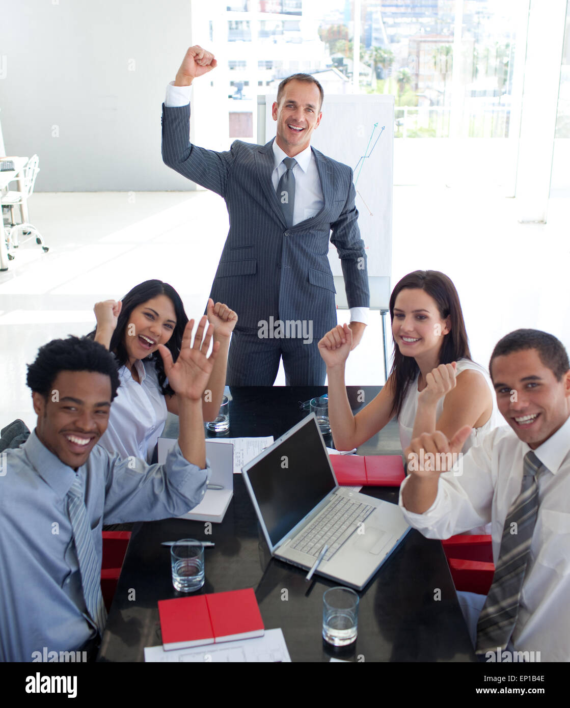 Business people in a meeting celebrating a success Stock Photo - Alamy