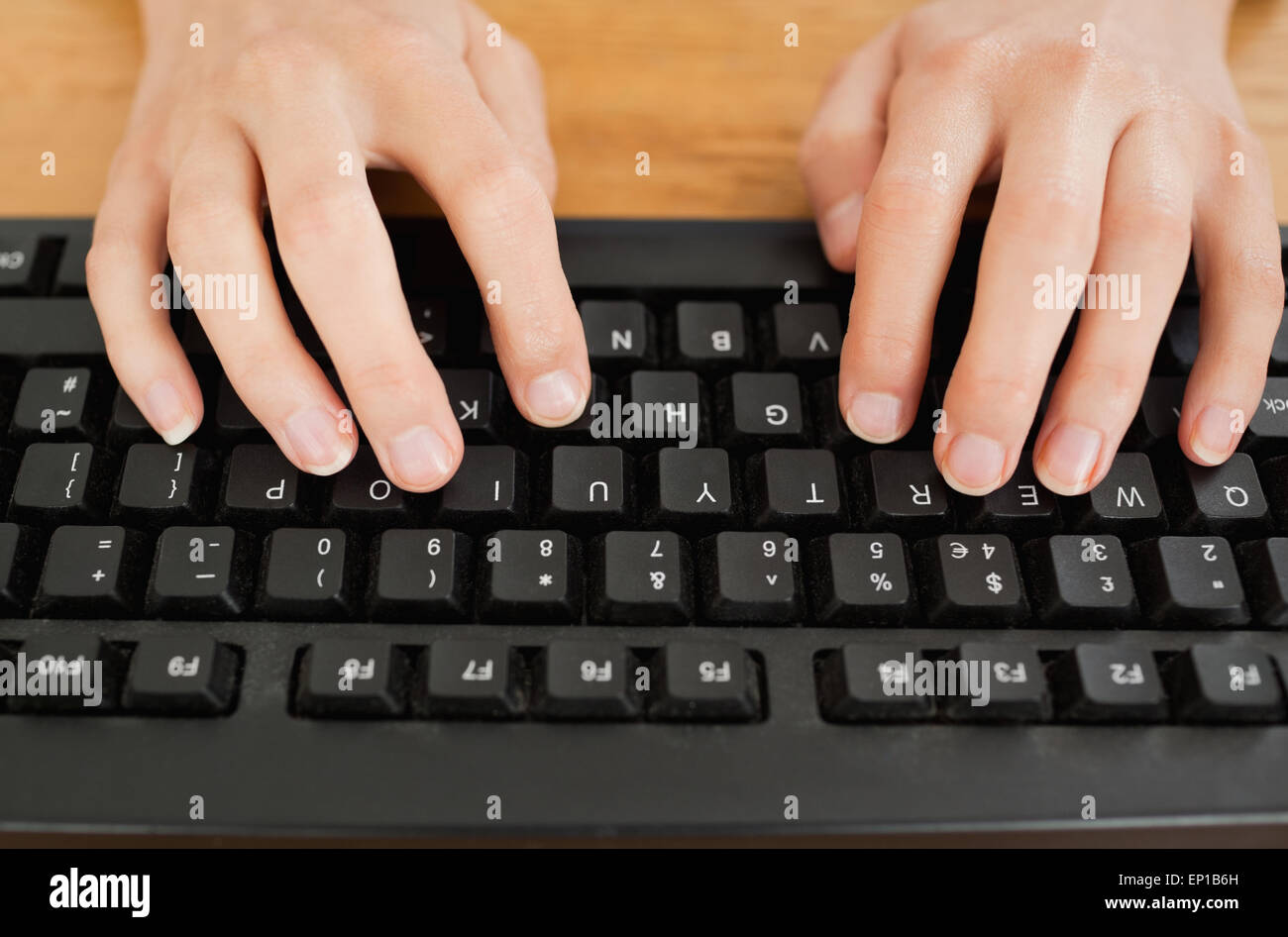 Typing woman on keyboard Stock Photo - Alamy