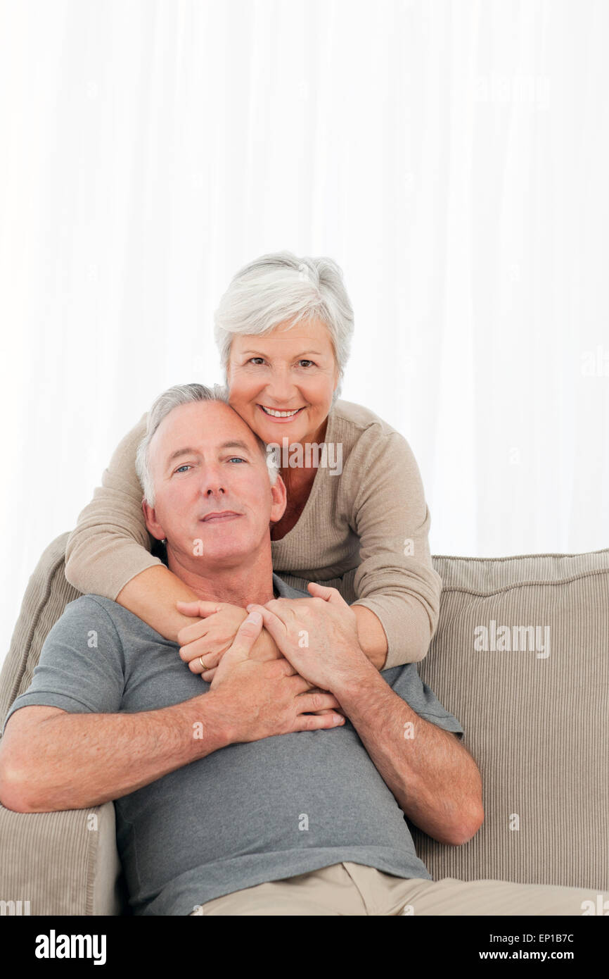 Lovers hugging while they are looking at the camera Stock Photo - Alamy