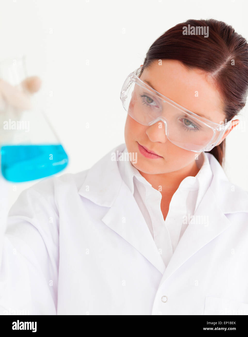 Beautiful scientist holding a beaker in a laboratory Stock Photo - Alamy