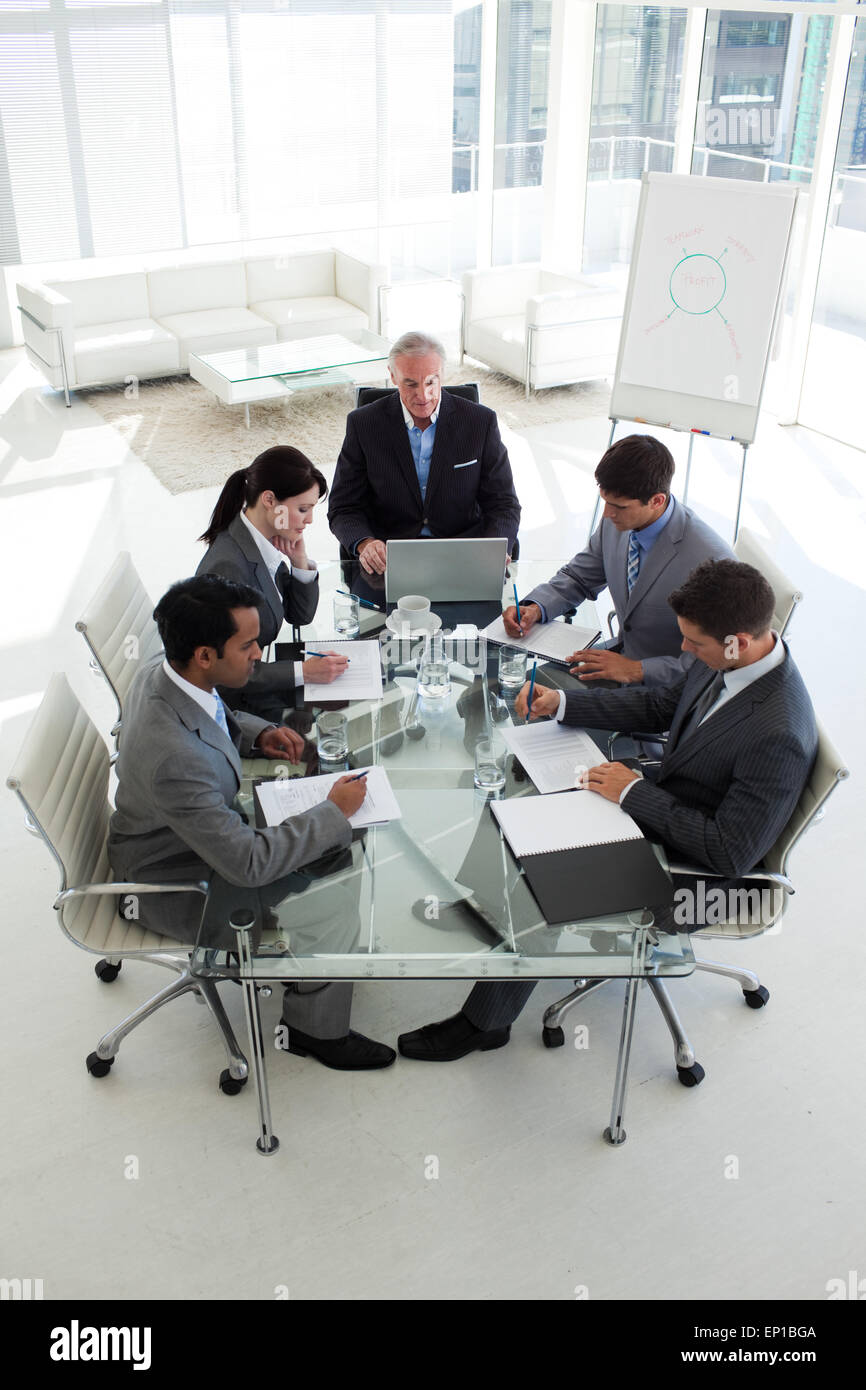 High angle of a senior manager in a meeting with his team Stock Photo ...