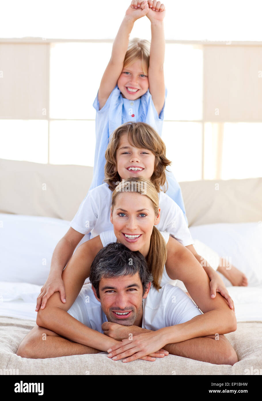 Jolly family having fun Stock Photo - Alamy