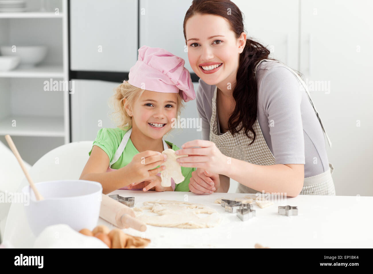 Happy girl showing cookie hi-res stock photography and images - Alamy