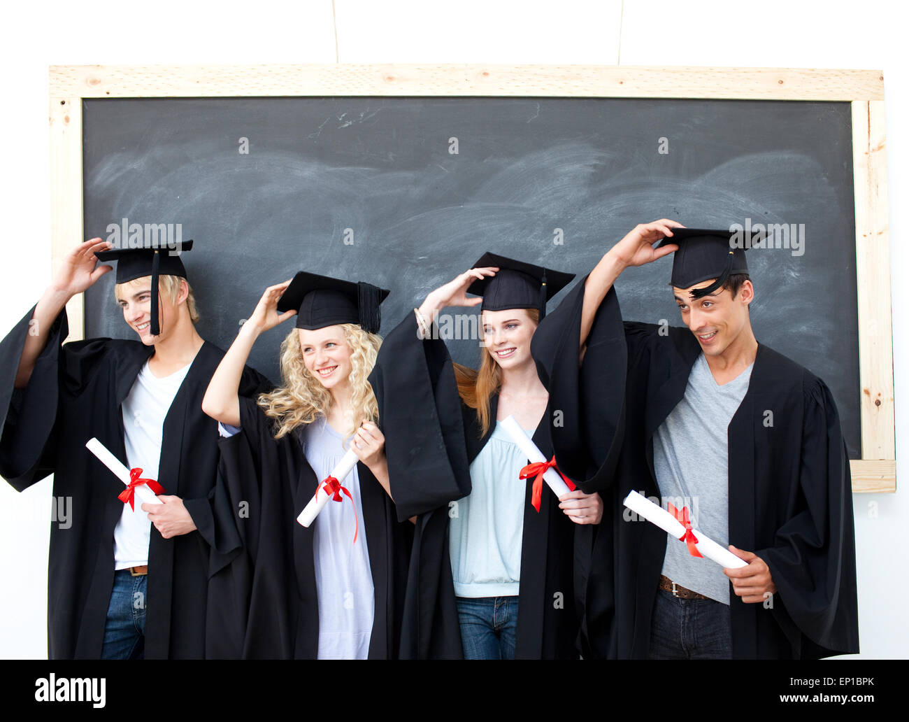 Group of teenagers celebrating after Graduation Stock Photo - Alamy