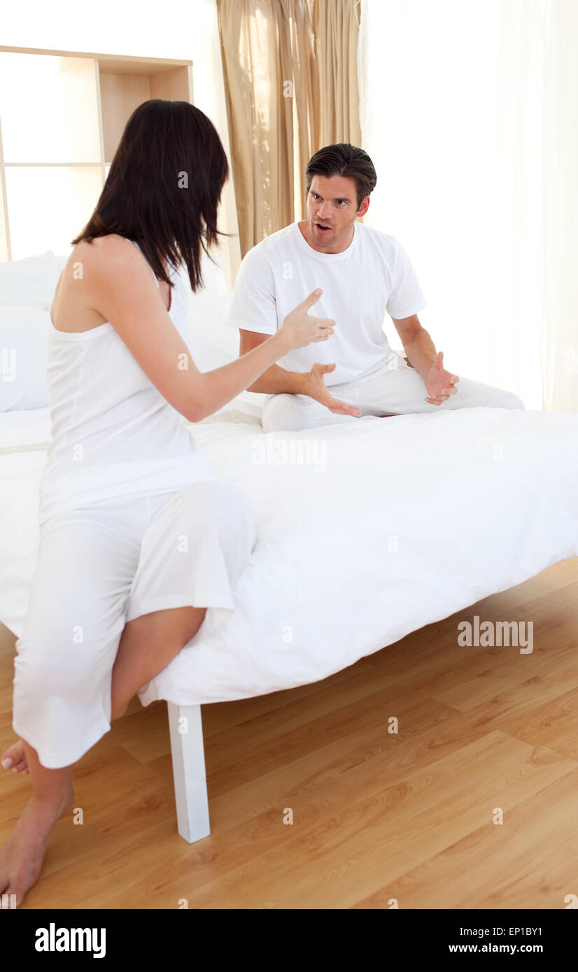 Couple on bed having a row Stock Photo - Alamy