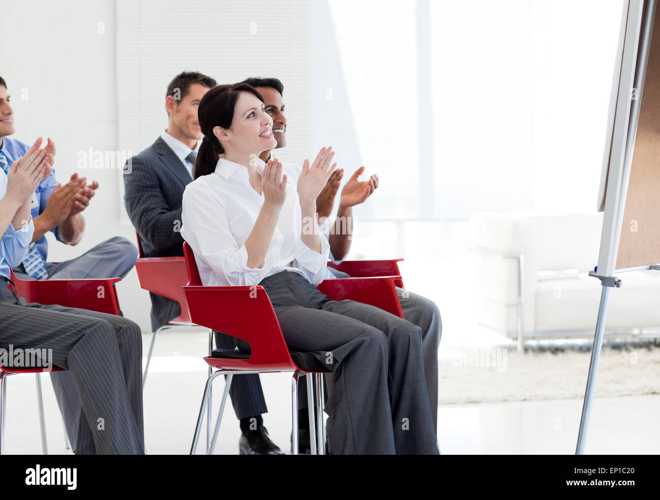 Multi-ethnic business people clapping at the end of a conference Stock ...
