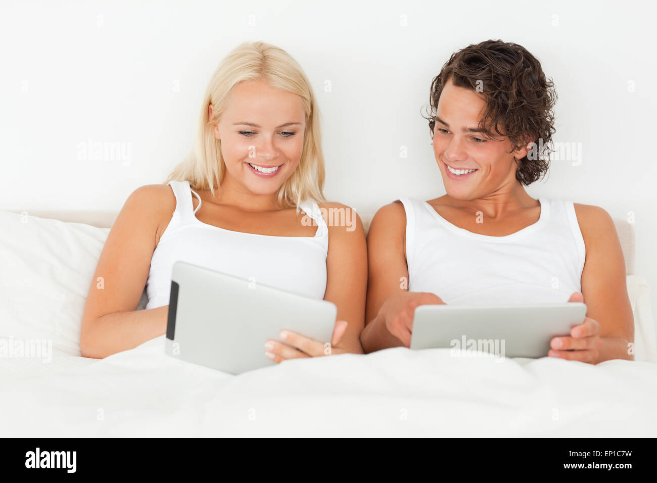 Couple using tablet computers Stock Photo - Alamy