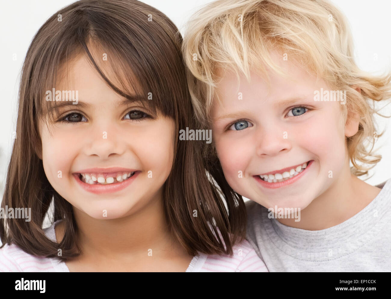 Portrait of two happy children in the kitchen Stock Photo - Alamy