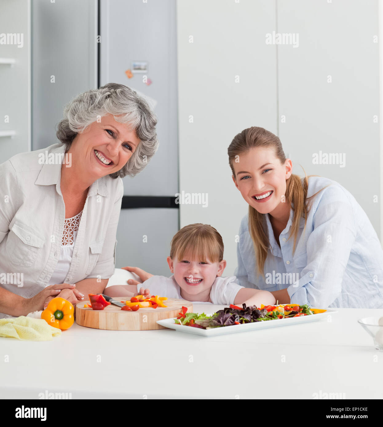 Family cooking together in the kitchen at home Stock Photo - Alamy