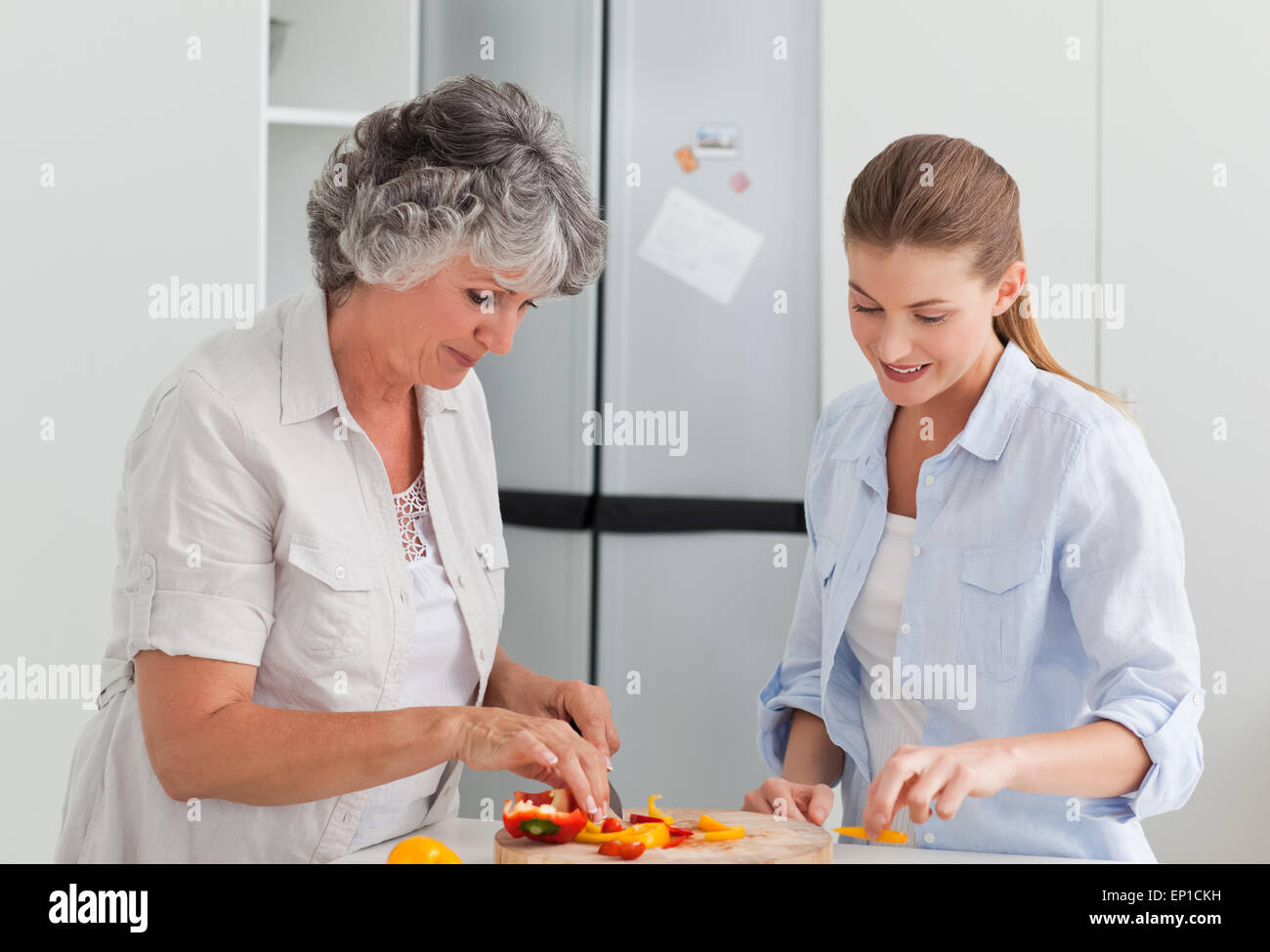 Woman cooking with her mother at home Stock Photo - Alamy