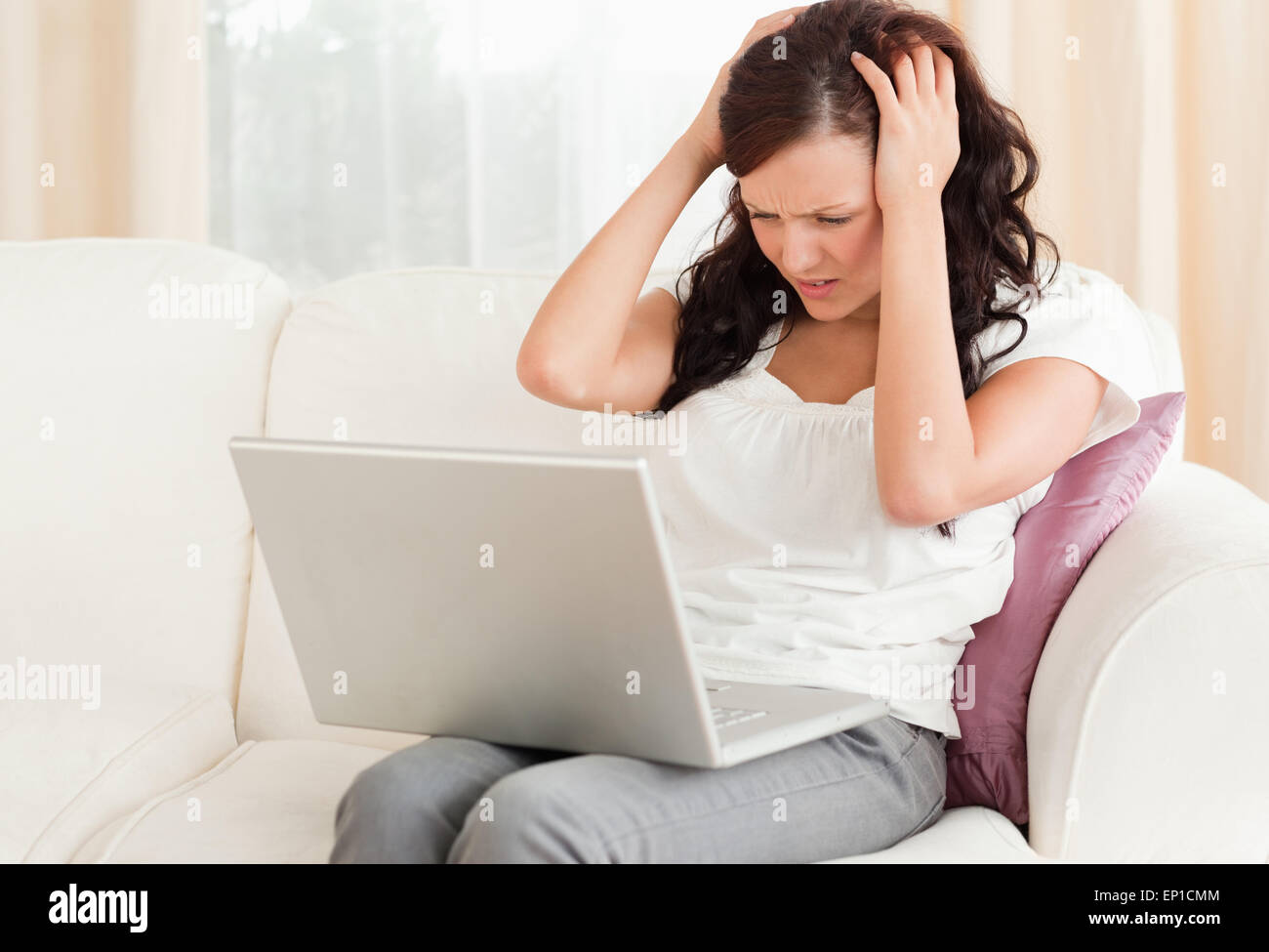Red-haired woman with laptop being frustrated Stock Photo - Alamy