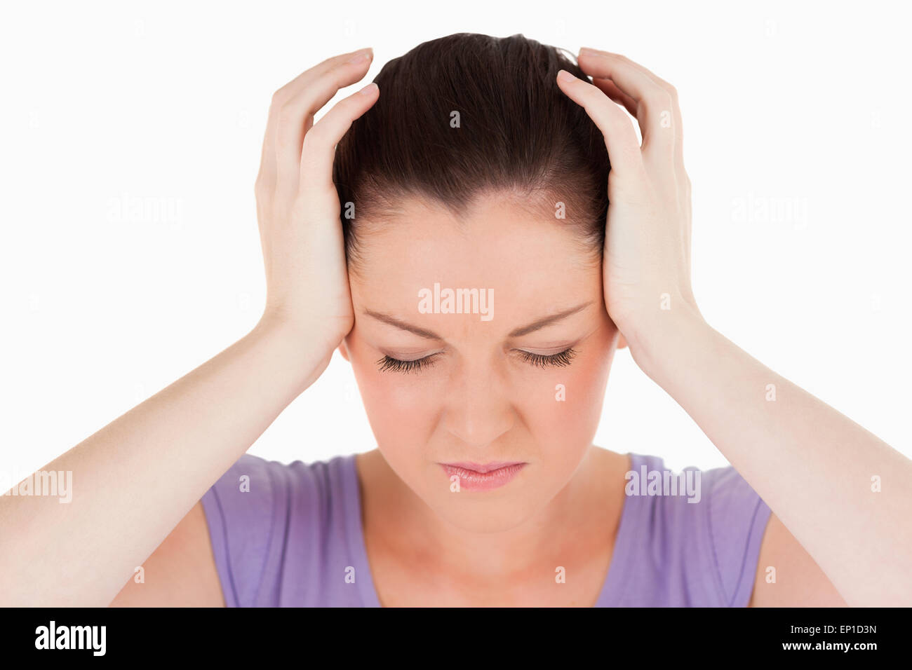 Portrait of an attractive woman having a headache while standing Stock ...