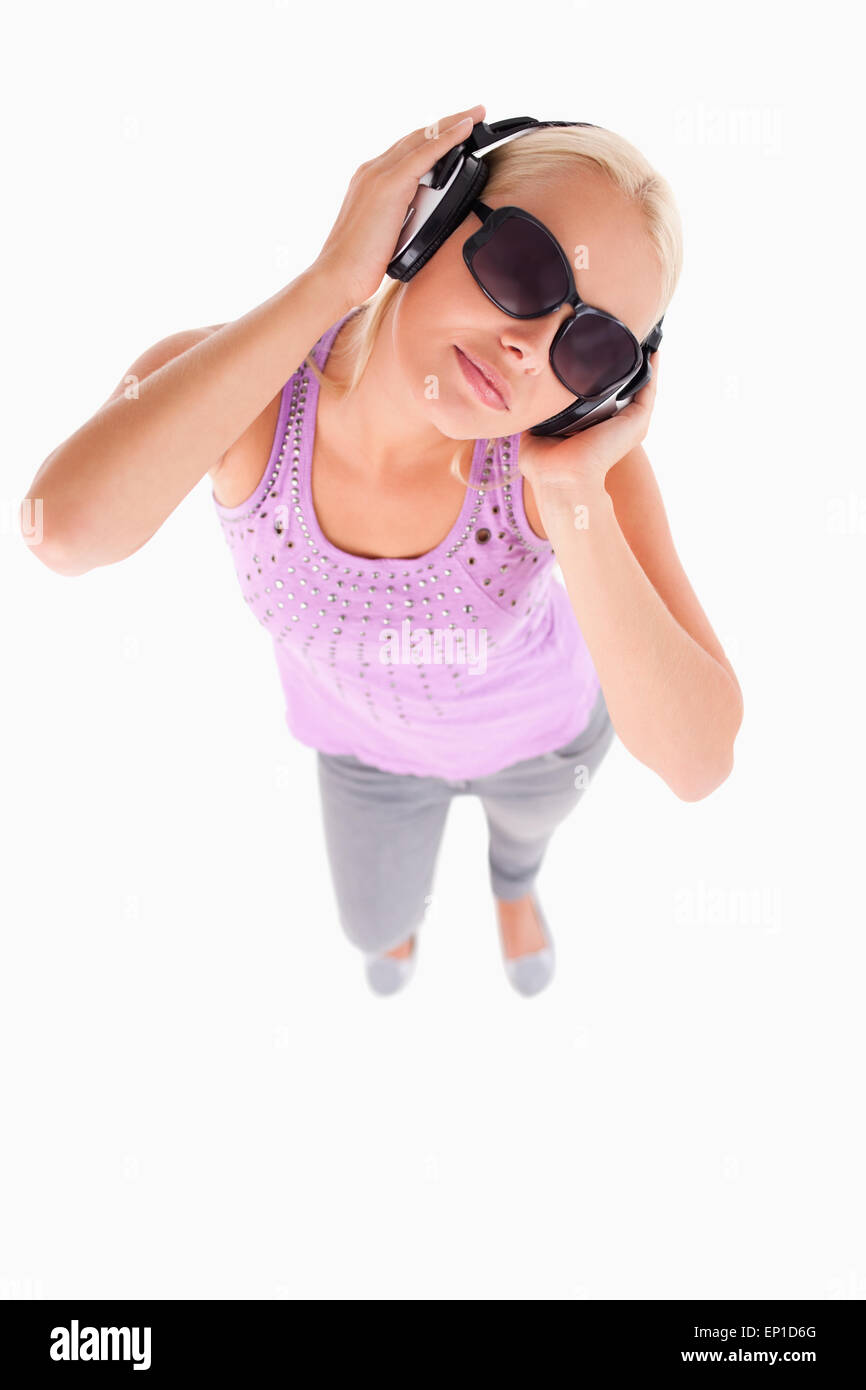 Glorious lady with sunglasses and earphones Stock Photo - Alamy