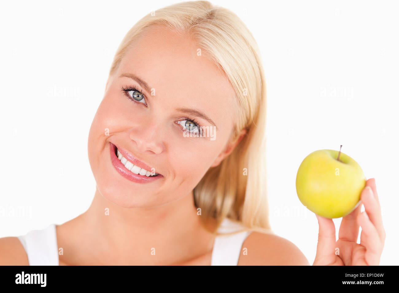 Charming woman holding an apple Stock Photo - Alamy