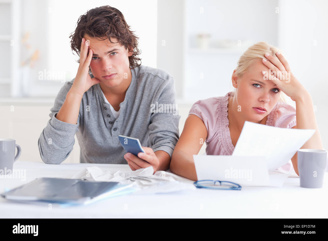 Worn down couple Stock Photo - Alamy