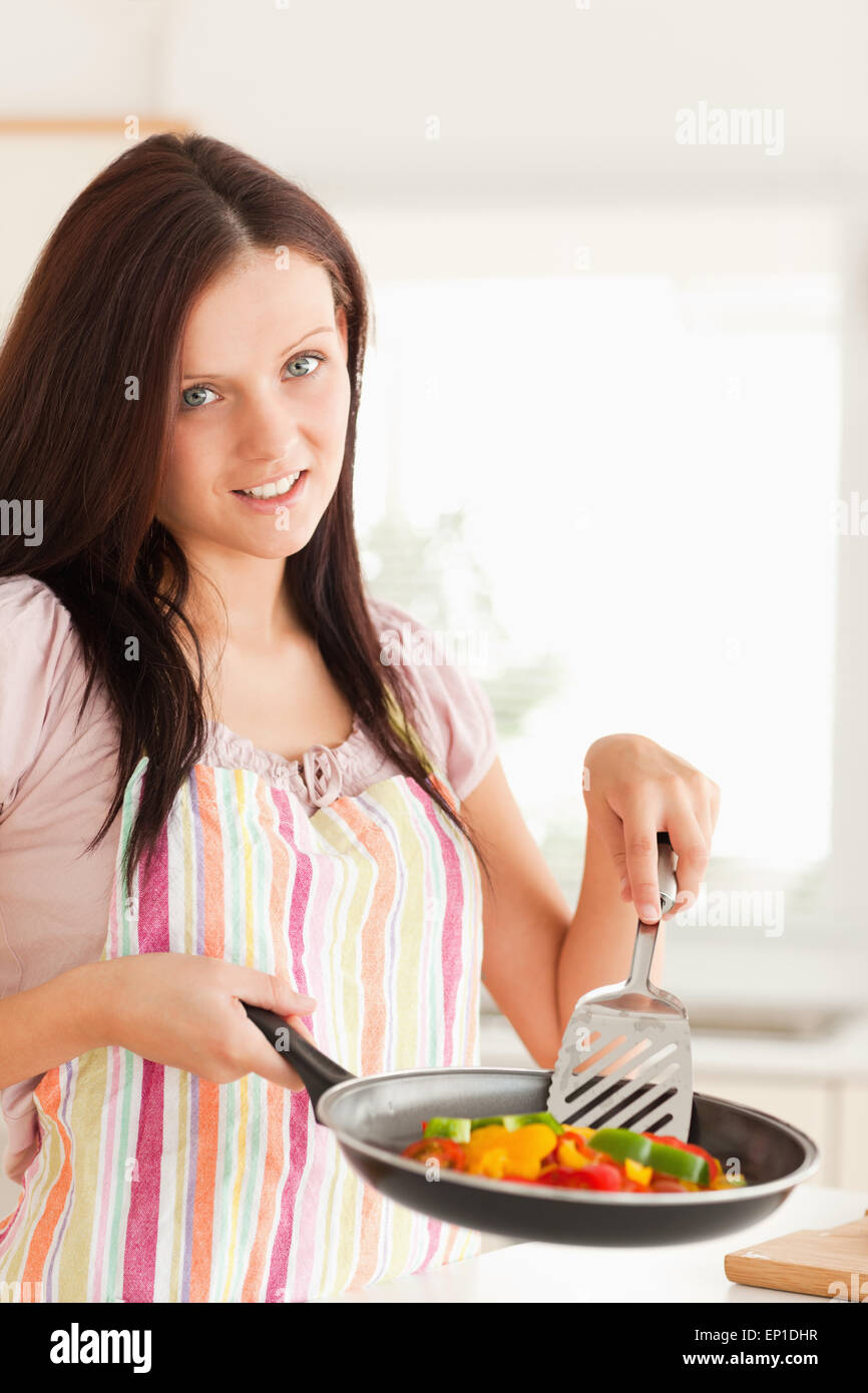 Woman frying vegetables hi-res stock photography and images - Alamy
