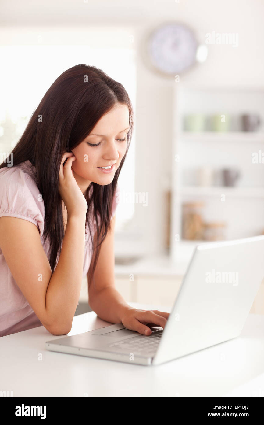 Woman looking at keyboard of laptop Stock Photo - Alamy
