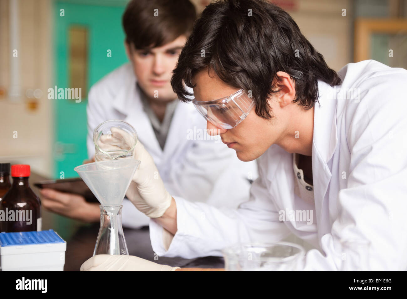 Students in chemistry making an experiment Stock Photo - Alamy