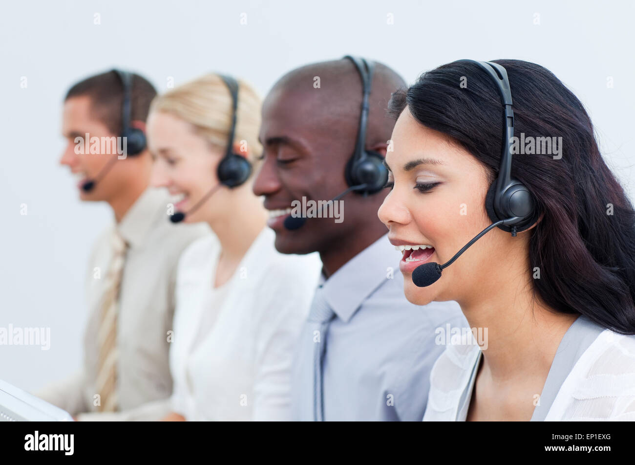 Multi-cultural business people working in a call center Stock Photo - Alamy