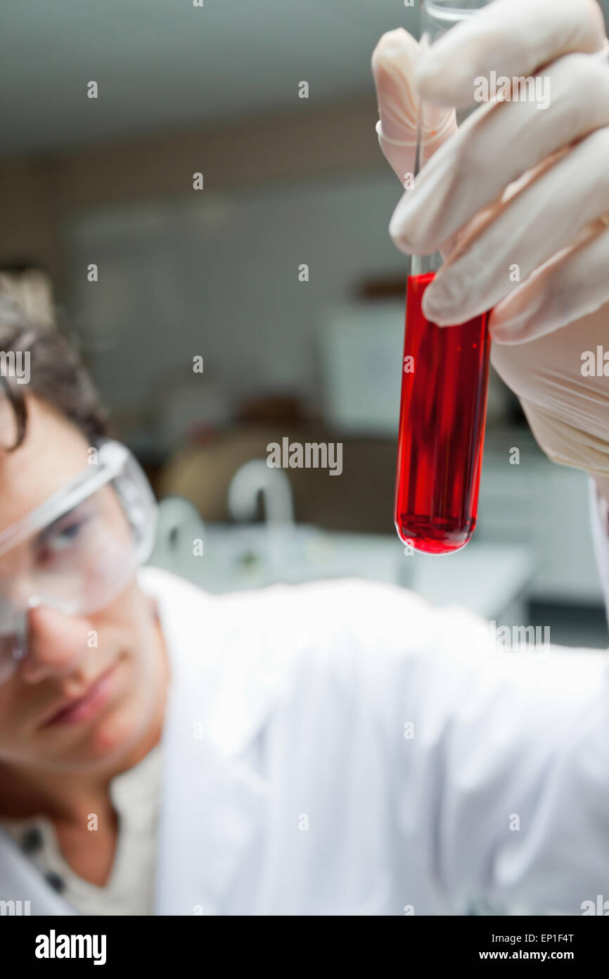 Portrait of scientist holding a test tube Stock Photo - Alamy