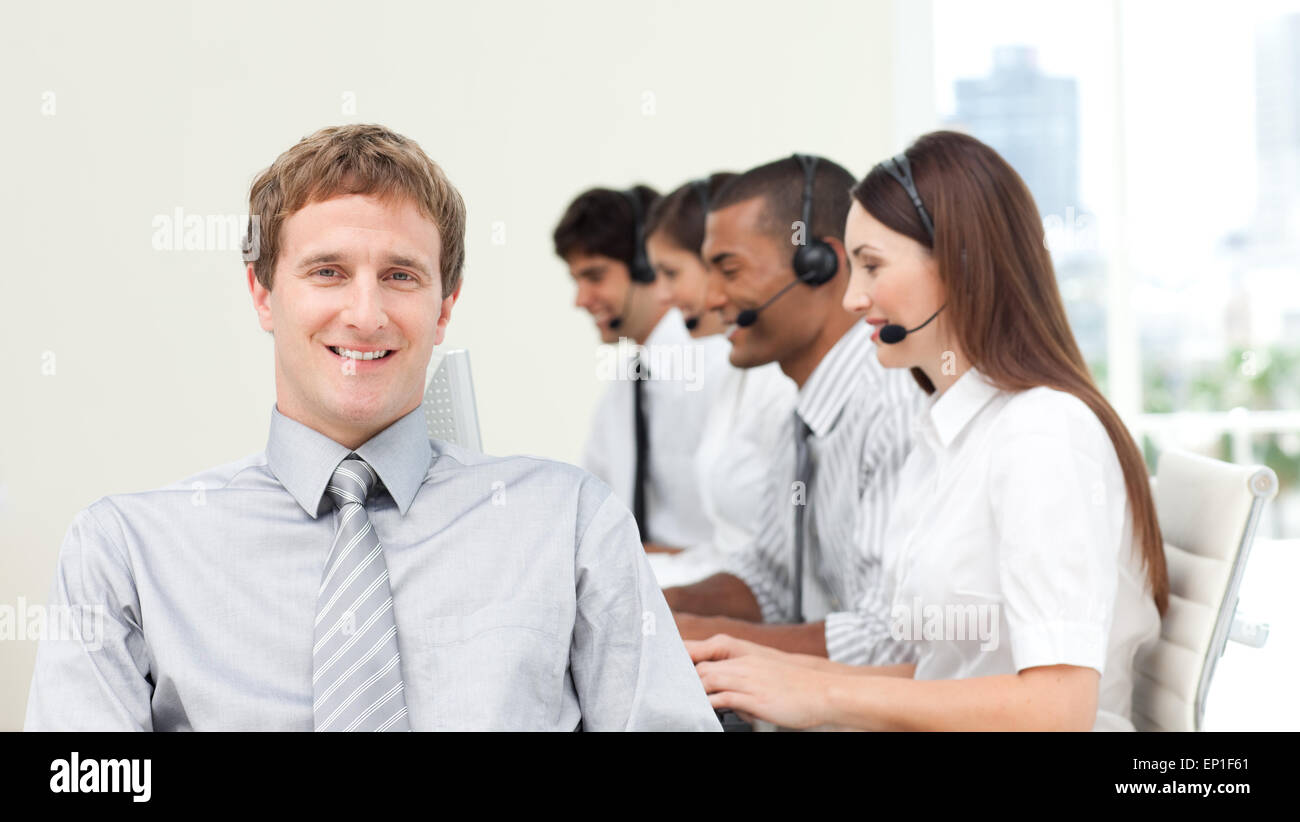 Attractive manager with his team Stock Photo - Alamy