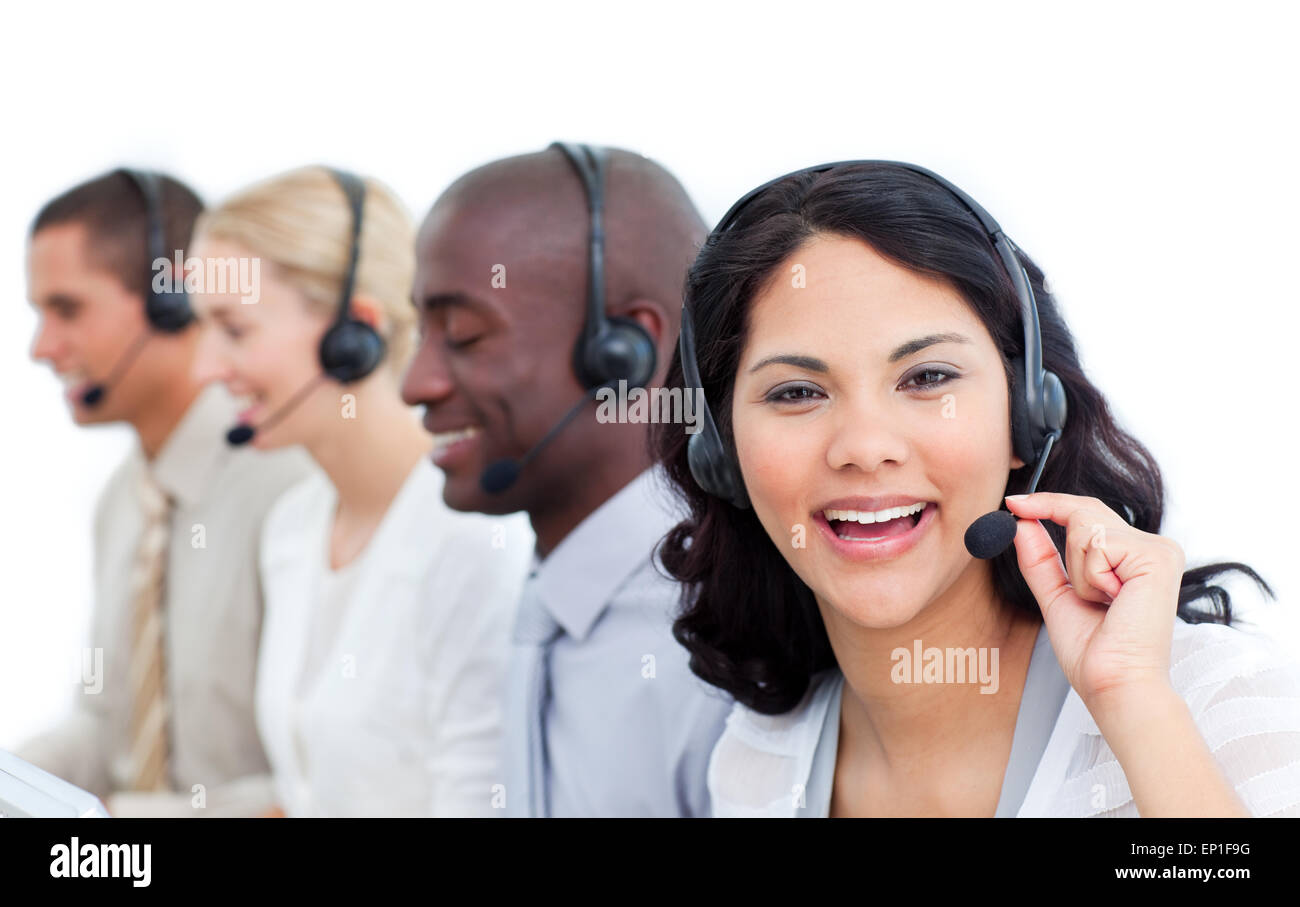 Attractive businesswoman and her team working in a call center against ...