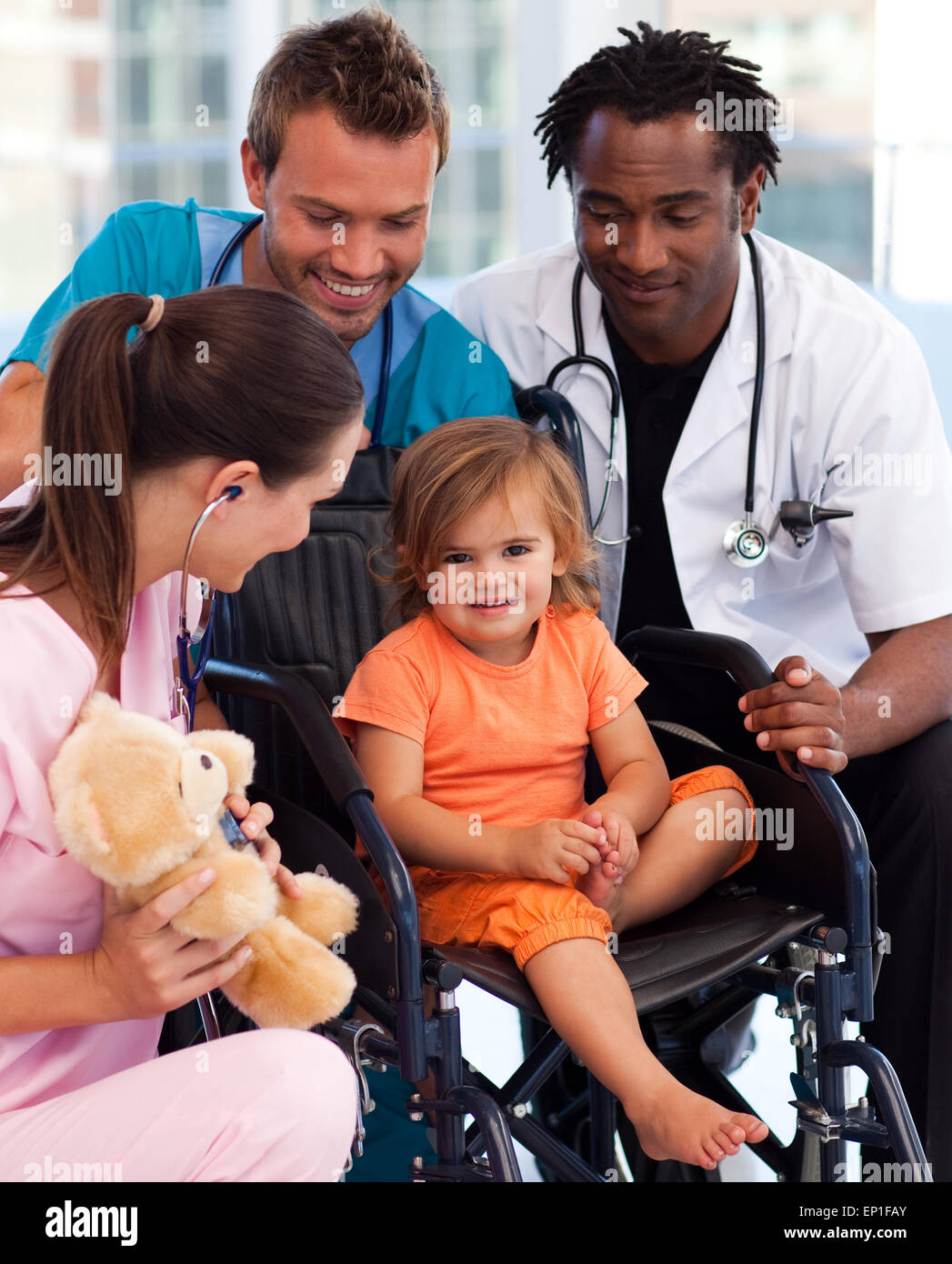 Portrait of a little patient with medical team Stock Photo - Alamy