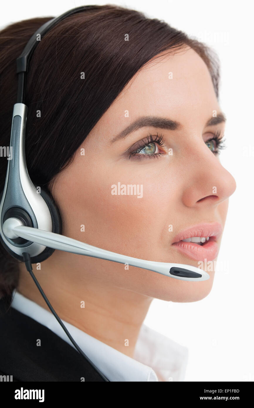 Green eyed businesswoman speaking in a headset Stock Photo - Alamy