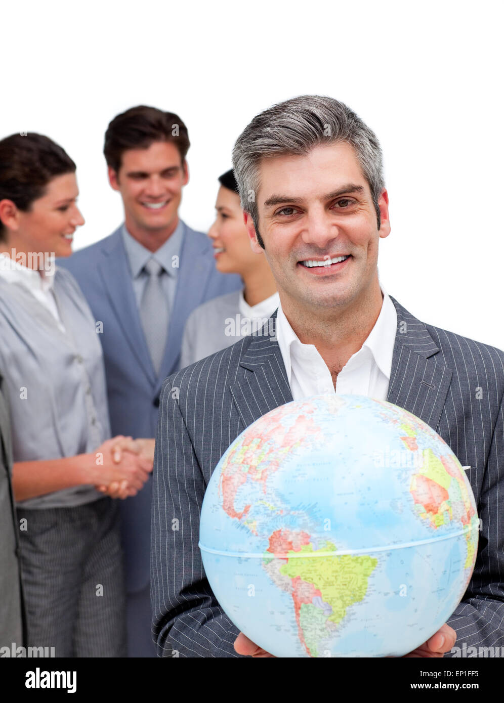 Ambitious manager and his team holding a terrestrial globe against a ...