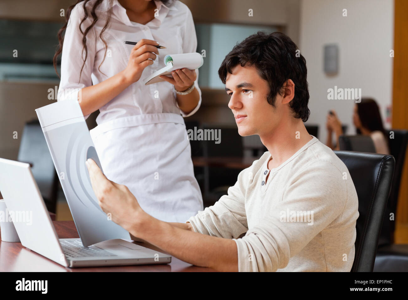 Man ordering food to a waitress Stock Photo - Alamy