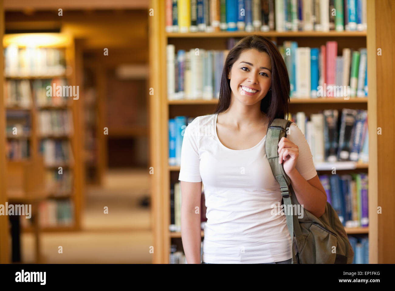 Smiling young student standing up Stock Photo - Alamy