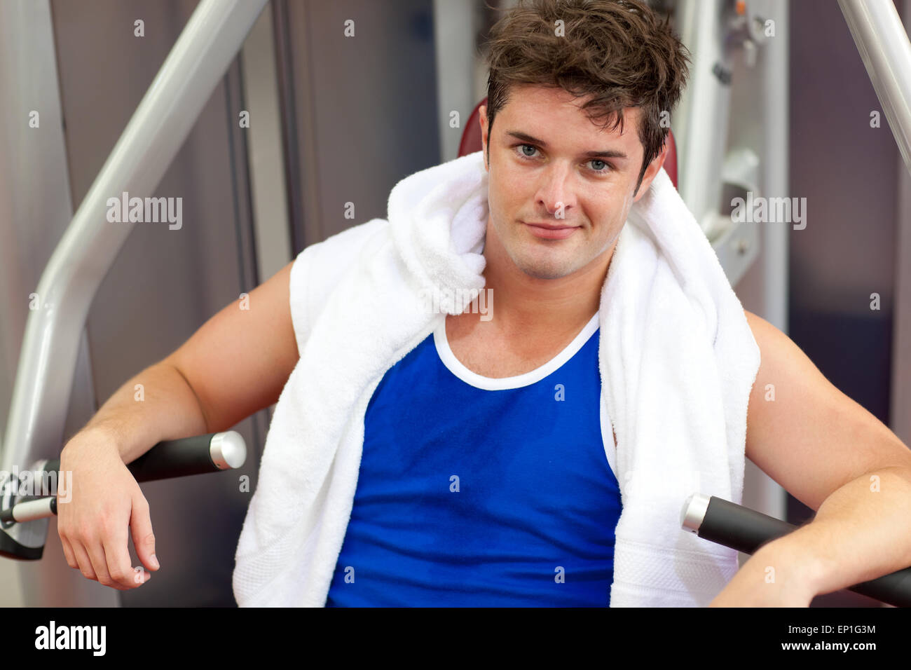 Handsome muscular man using a bench press Stock Photo - Alamy
