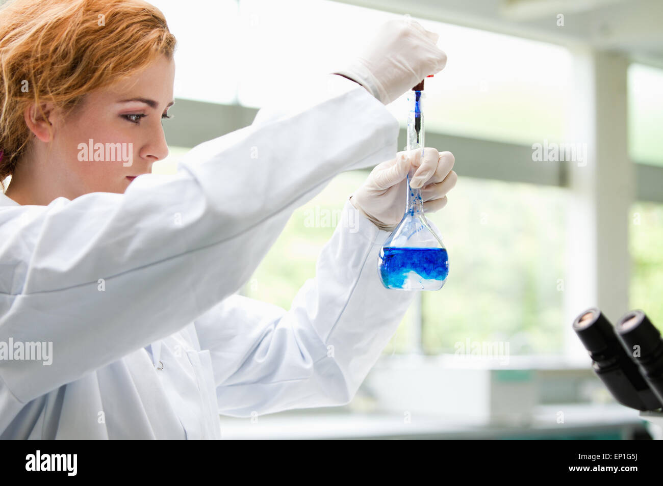 Scientist drops blue liquid hi-res stock photography and images - Alamy