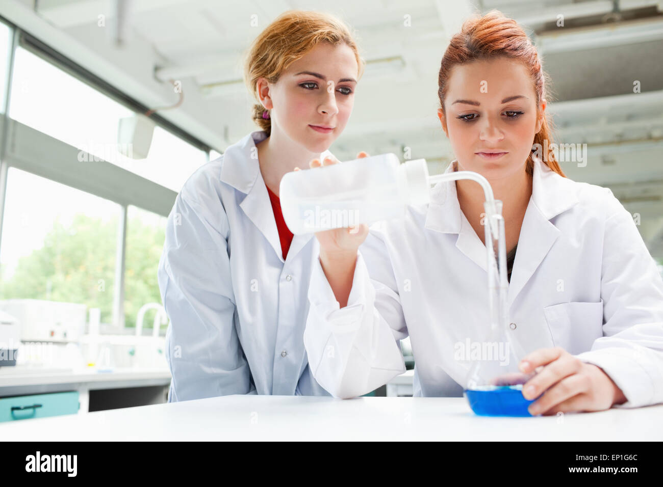 Scientists doing an experiment Stock Photo - Alamy