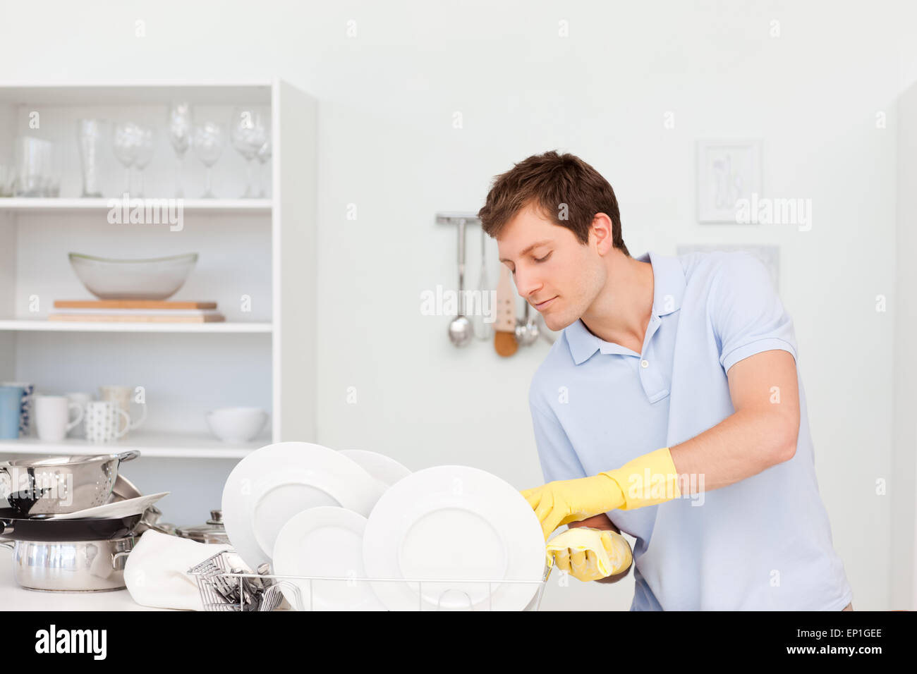 Man washing dishes Stock Photo - Alamy