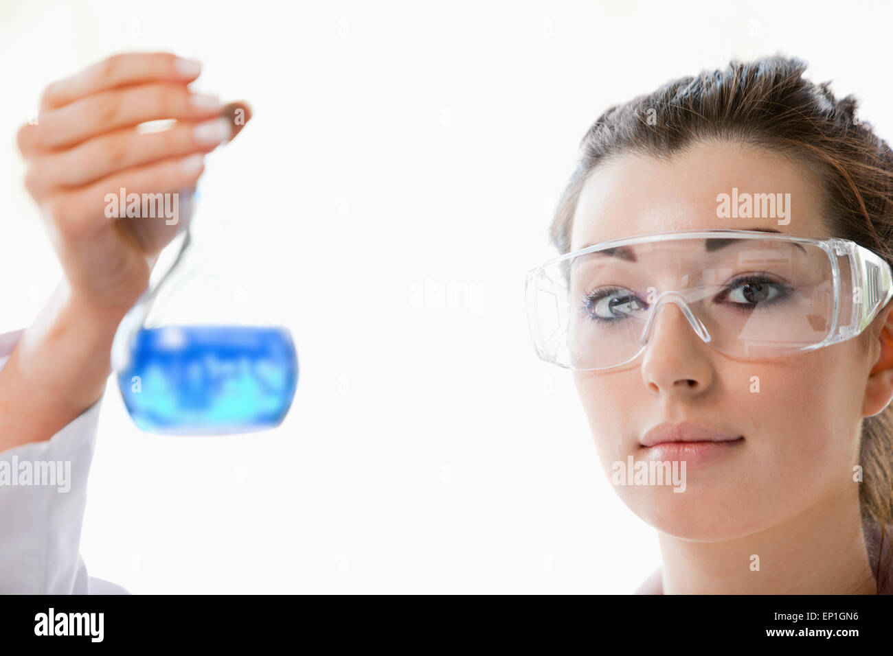Close up of a scientist holding a flask Stock Photo - Alamy