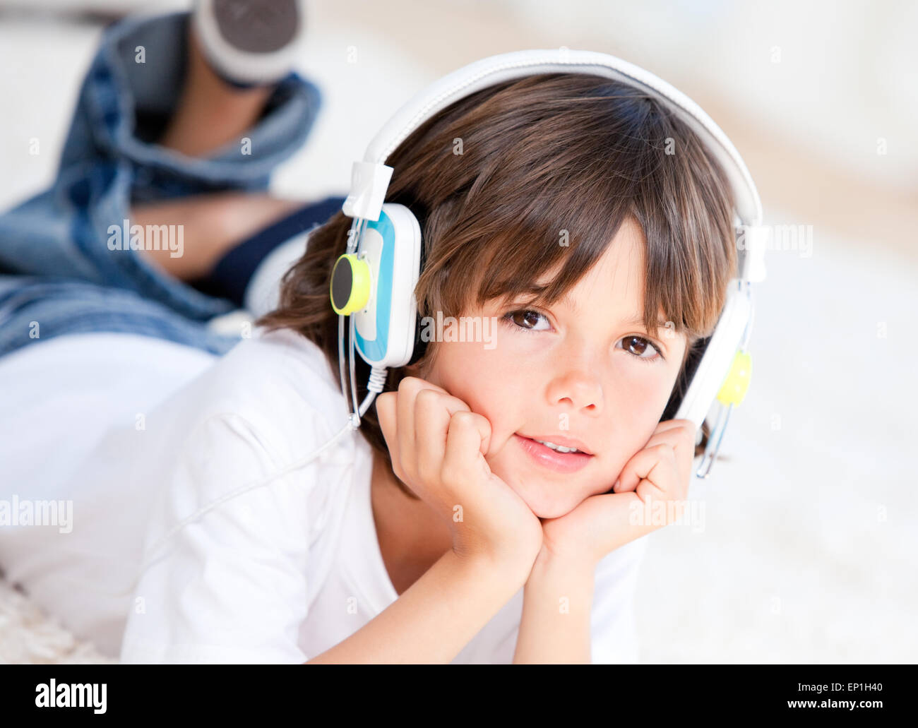 Liitle boy listenning music Stock Photo - Alamy