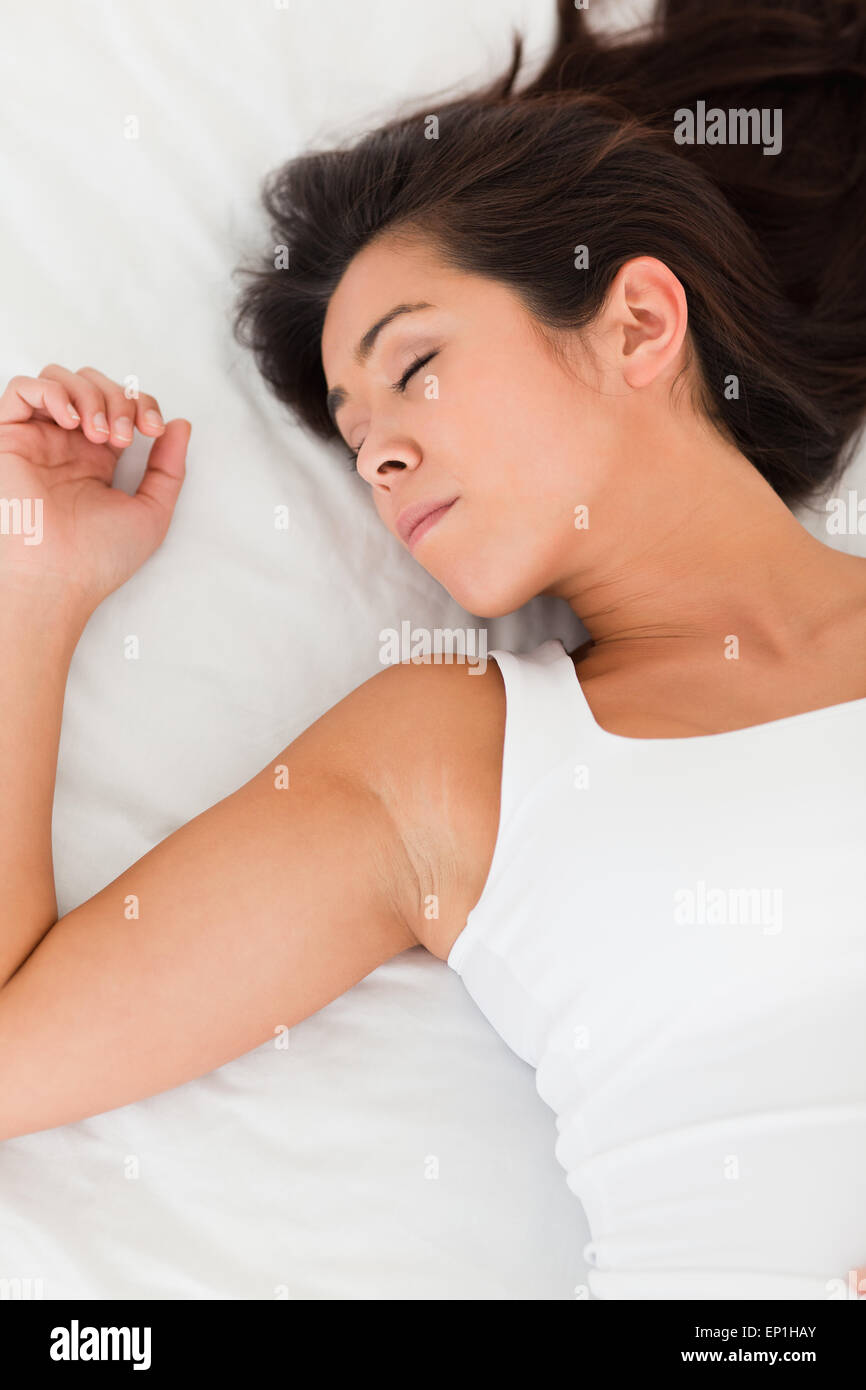 sleeping woman lying on bed Stock Photo - Alamy