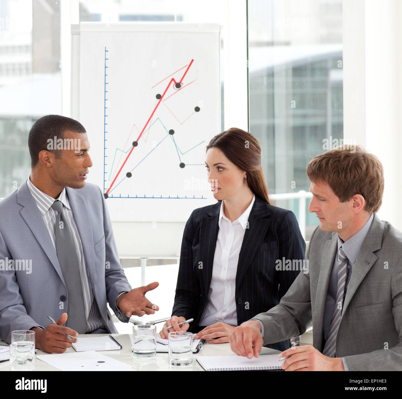 Serious co-workers studying a new business plan Stock Photo - Alamy